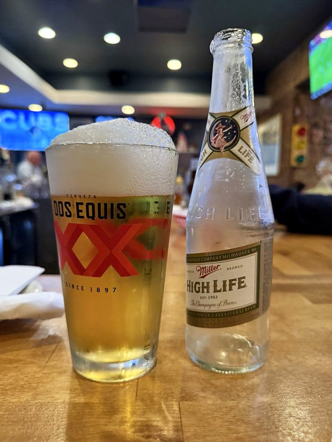 Cold beer meets frosted glass in perfect harmony, creating the ideal companion for crispy chicken adventures.