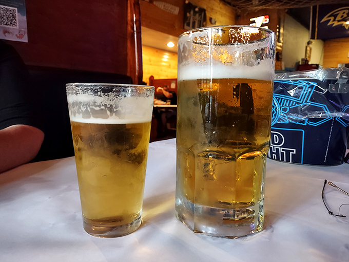 Cold beer glasses stand at attention, ready to provide cooling relief from all that perfectly spiced seafood.