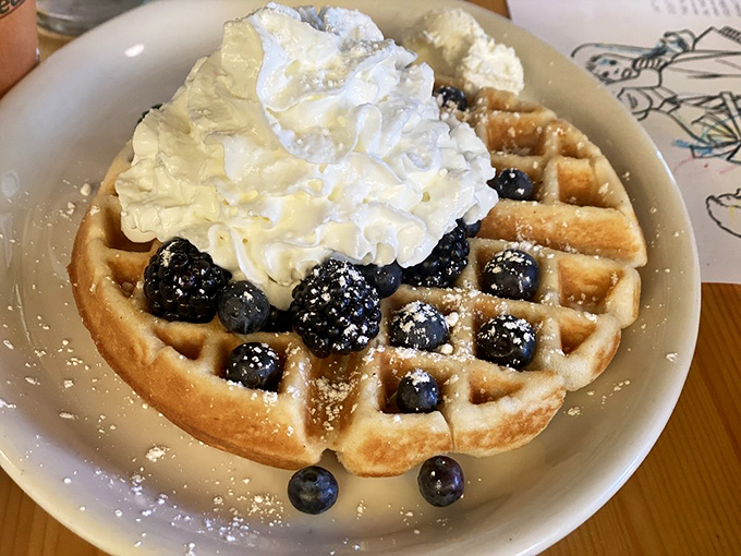 This Belgian waffle topped with berries and whipped cream isn't just breakfast&mdash;it's what dessert dreams about becoming when it grows up.