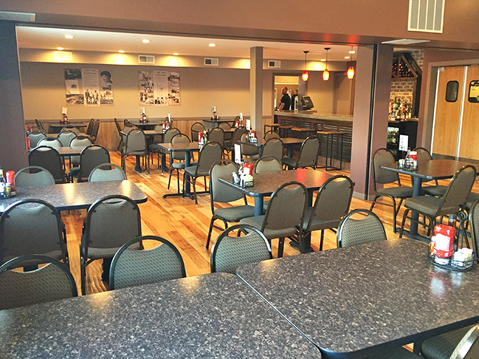 Warm wooden tables await conversations both meaningful and mundane. The dining room where strangers become neighbors over coffee.
