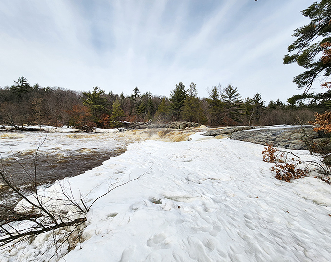 Big Falls County Park showcases Wisconsin's wild side, where rushing waters carve through snow and stone with the persistence of time itself.