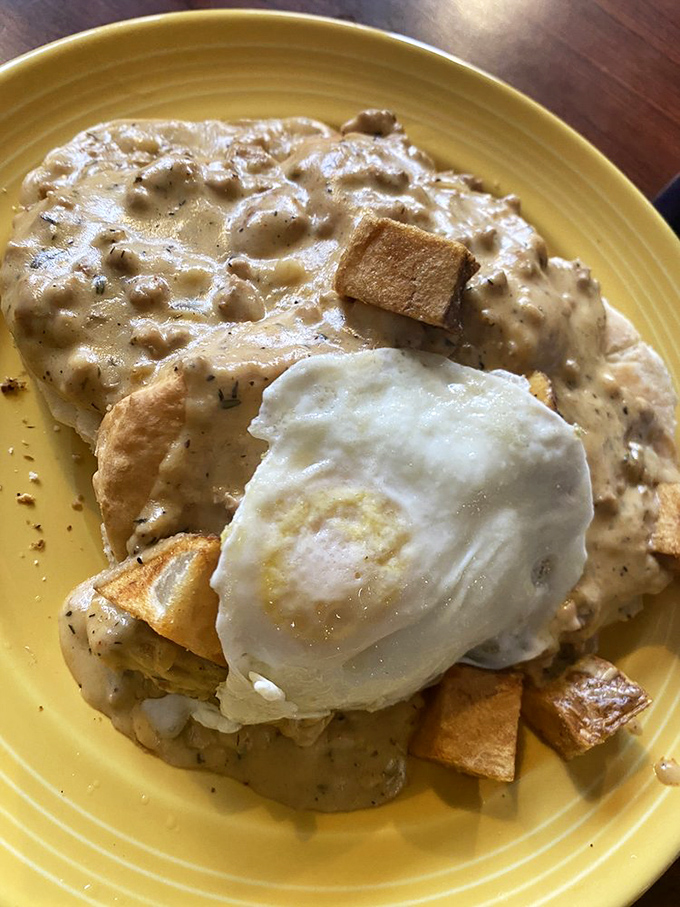 Biscuits and gravy with a sunny-side-up egg &ndash; the breakfast equivalent of a warm hug from your favorite grandma. Pure comfort in yellow ceramic.