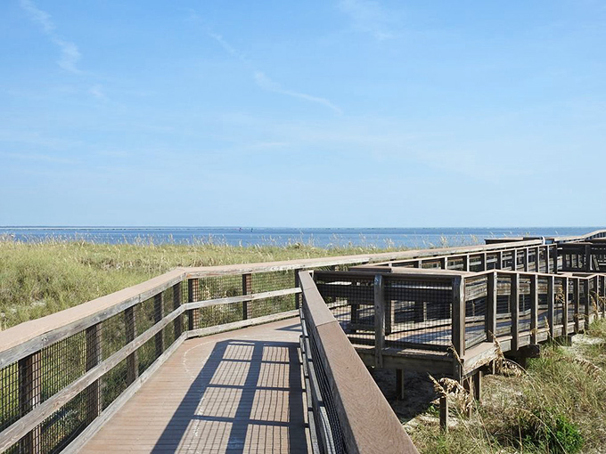 The boardwalk to beach bliss. Those weathered planks have carried thousands of flip-flops toward that perfect horizon where sky meets Atlantic.