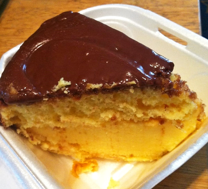 This Boston cream pie doesn't need fancy plating &ndash; that glossy chocolate top and custard center speak volumes without saying a word.