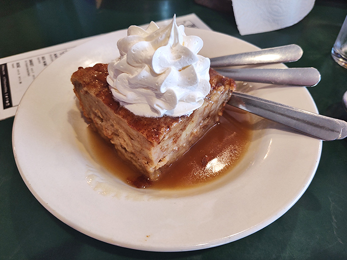 Bread pudding that doesn't so much end your meal as provide a standing ovation for it, topped with a cloud of whipped cream.