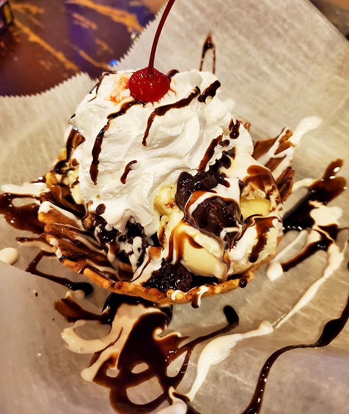 A brownie sundae that makes you question why you ever wasted time on lesser desserts. That whipped cream mountain deserves a flag.