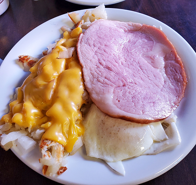 Ham steak and cheesy potatoes creating the kind of brunch dreams that fuel weekend adventures.