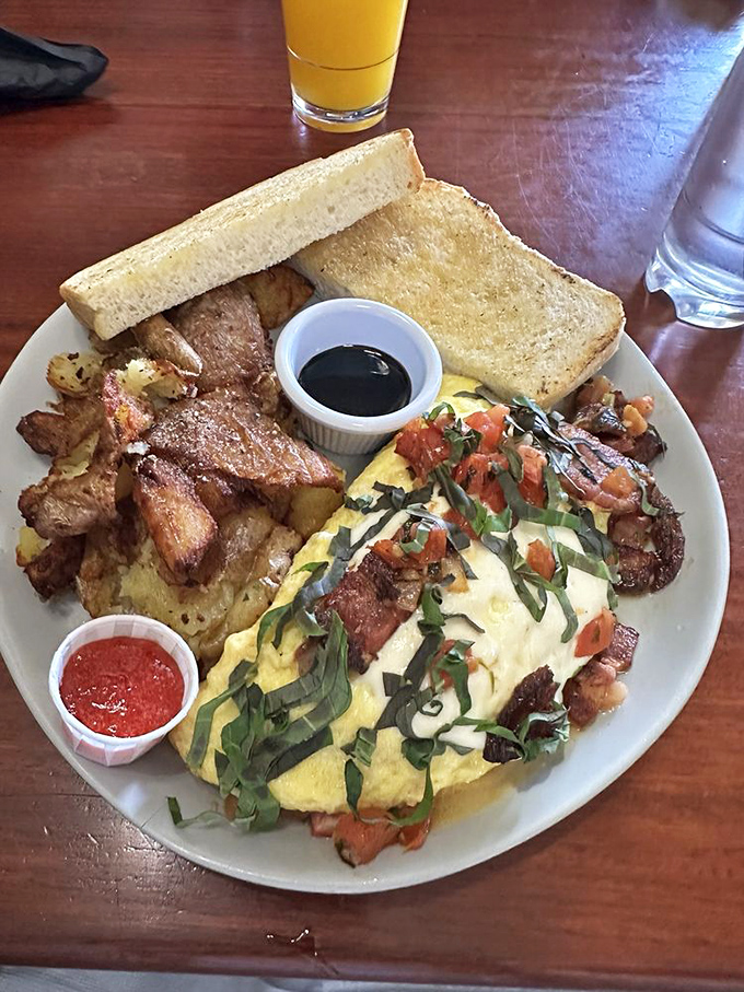 Not all heroes wear capes&mdash;some wear fresh herbs and tomatoes. This omelet brings garden-fresh flavor to the breakfast table with artistic flair.