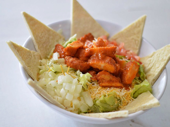 A taco salad that thinks outside the shell. Those crispy tortilla points stand at attention, ready for their dipping duties.