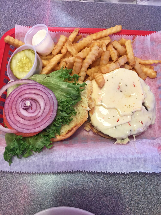 A burger that requires both hands and several napkins. The mark of greatness isn't just in taste, but in how gloriously messy it gets.