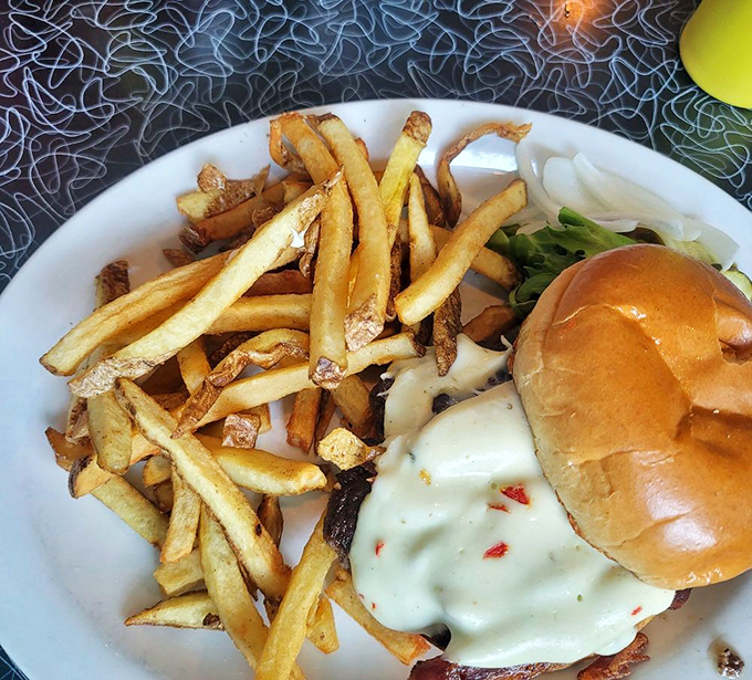 A burger and fries that doesn't need Instagram filters &ndash; just honest ingredients coming together in a symphony of comfort food perfection.