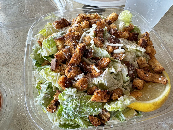 Caesar salad with seafood&mdash;where healthy intentions meet delicious reality. The croutons are just there to add moral support.