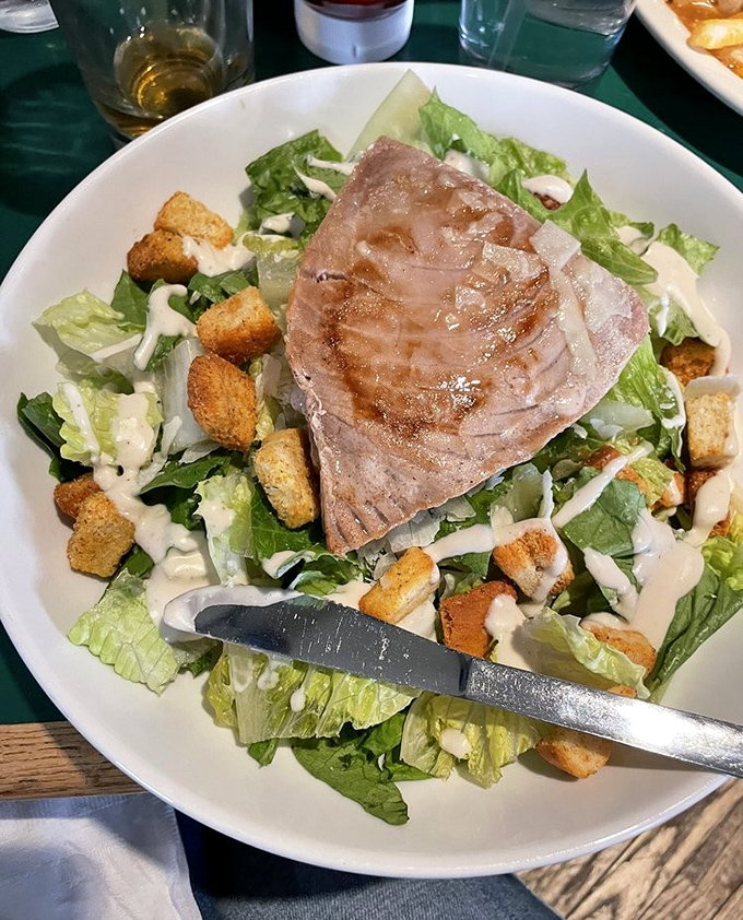 A Caesar salad elevated from supporting character to star with the addition of perfectly seared ahi tuna&mdash;proof that bar food can absolutely be sophisticated.