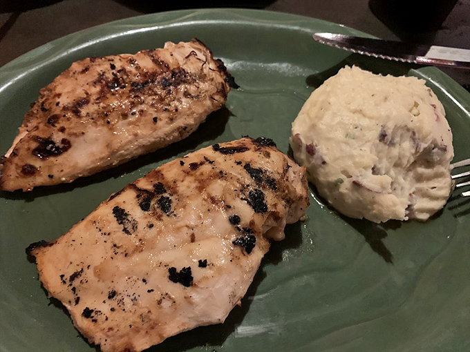 Campfire chicken that brings outdoor adventure to your indoor dining experience, perfectly grilled and ready for serious appreciation.