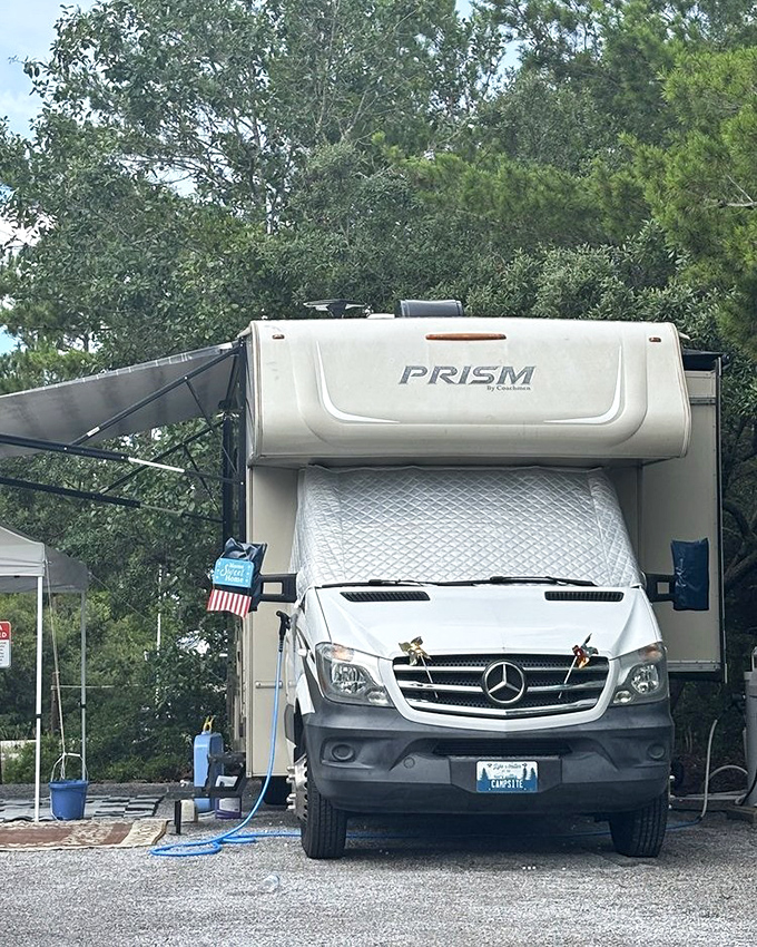 Camping in style: Where the pine forest meets modern comfort. This RV spot offers the perfect basecamp for Grayton Beach adventures.