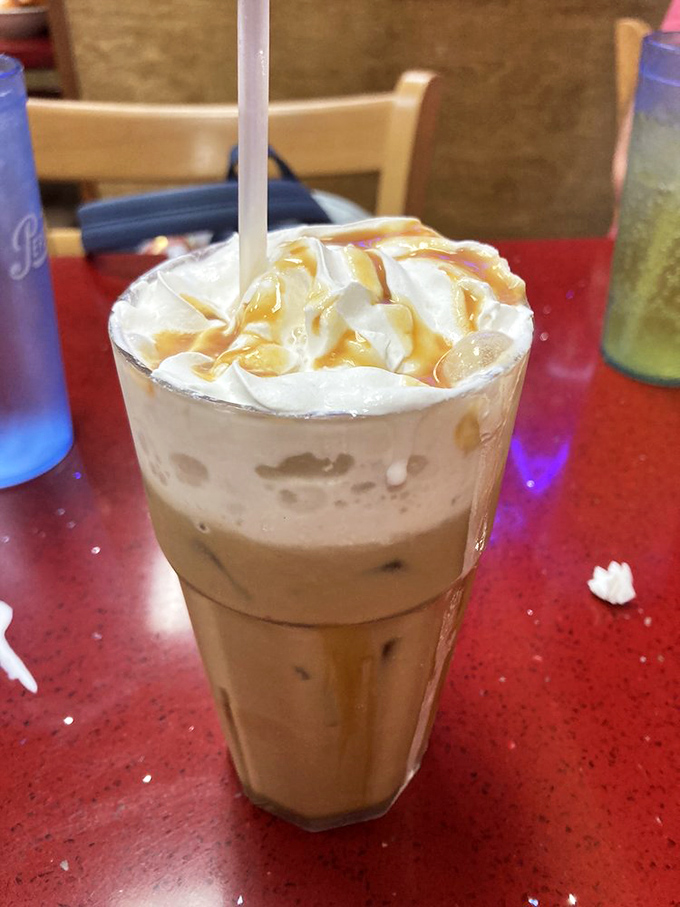 Their iced coffee comes dressed for success &ndash; caramel drizzle and whipped cream transform morning caffeine into a celebration in a glass.