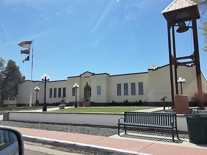 This stately building houses Springerville's cultural treasures, where flags fly proudly and the bell tower stands ready to announce community gatherings.
