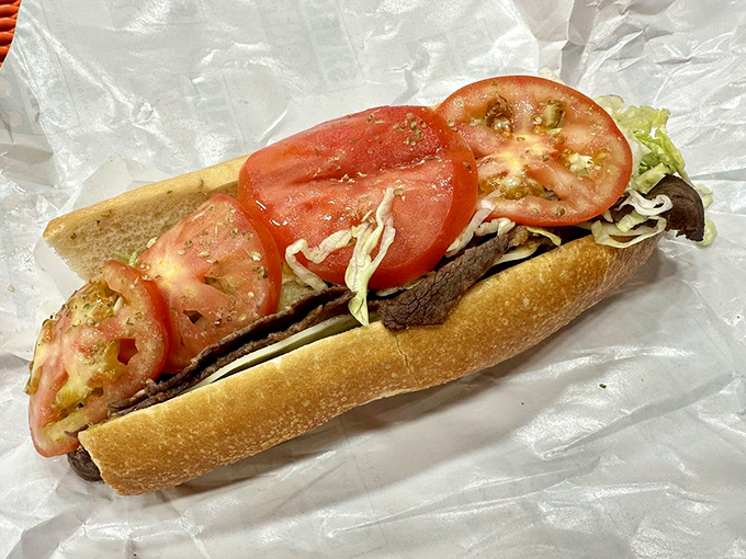 Fresh tomatoes and lettuce join the party in this cheesesteak hoagie. It's like the sandwich equivalent of wearing a tuxedo T-shirt.