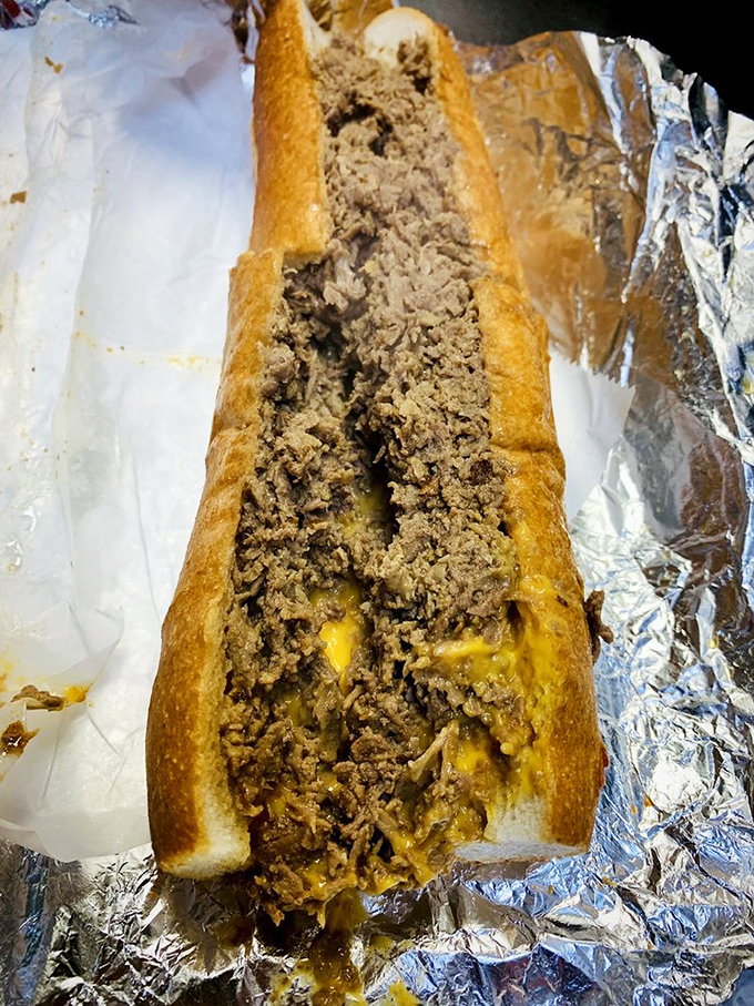 The classic cheesesteak with Whiz&mdash;molten gold cascading through seasoned beef. This isn't just a sandwich; it's Philadelphia's soul between two pieces of bread.