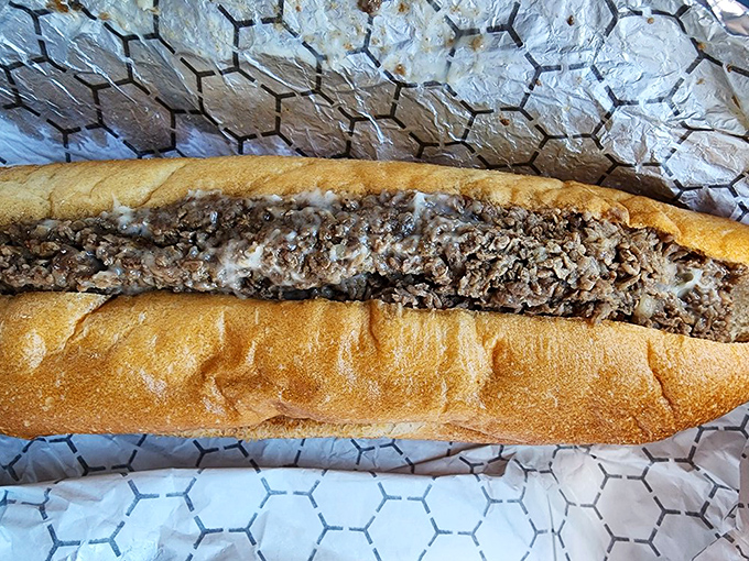 This cheesesteak flaunts its extra cheese like a 1980s rock star flaunted hairspray – with shameless abundance and zero regrets.