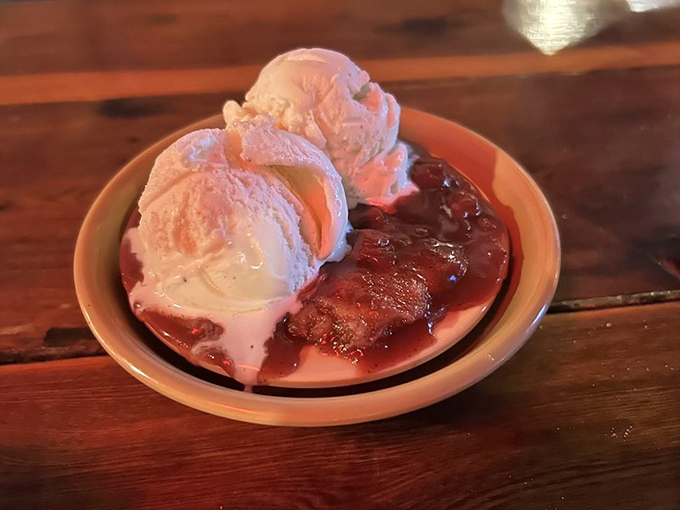 Cherry cobbler that makes you understand why people used to fight duels over honor. Two scoops of vanilla ice cream create the perfect hot-cold romance.