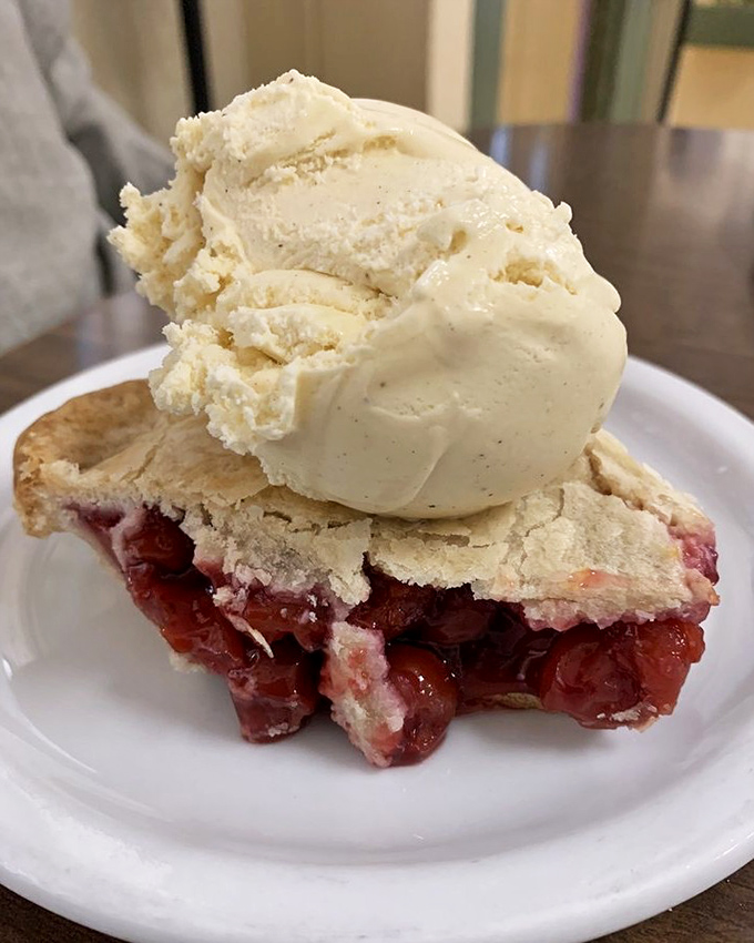 Cherry pie that makes you understand why people write songs about desserts, topped with ice cream melting just slowly enough to savor every bite.