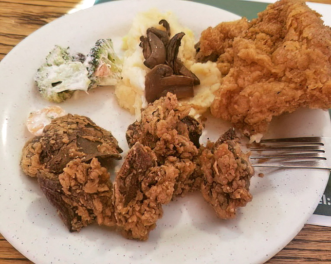 Crispy chicken livers for the adventurous soul, paired with creamy mashed potatoes and gravy&mdash;a Southern delicacy that divides families but conquers hearts.