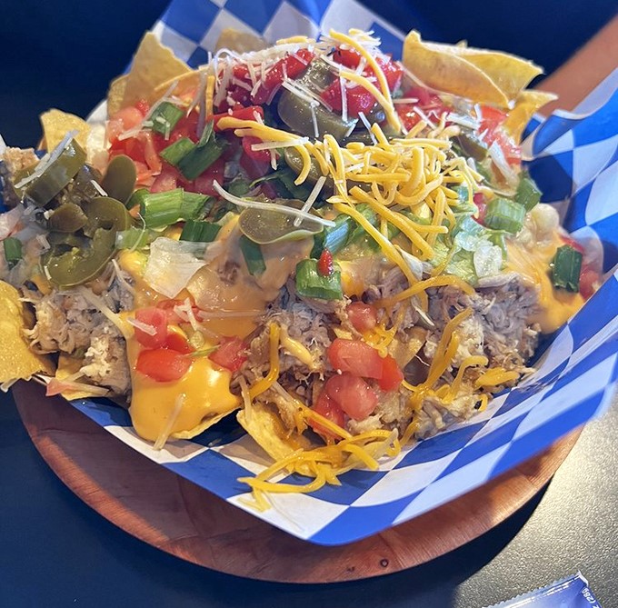 These nachos arrive like a delicious mountain you're genuinely excited to climb, cheese avalanche and all.