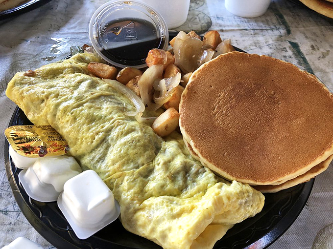 An omelet and pancakes that answer the eternal breakfast question: "Why choose when you can have it all?"