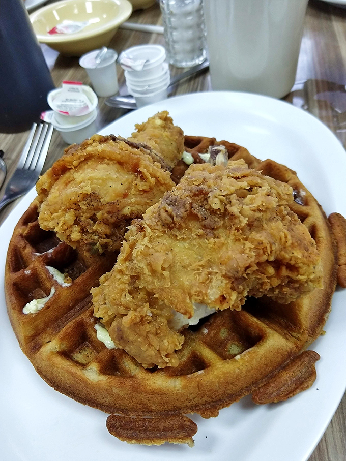 Southern ingenuity at its finest&mdash;golden-brown chicken perched atop a waffle throne, waiting for that magical moment when maple syrup ties everything together.