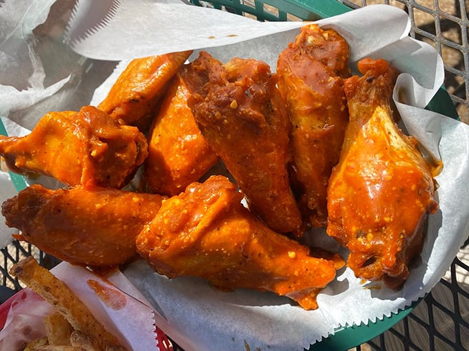 Buffalo wings glowing with tangy promise. These aren't just wings &ndash; they're flavor vehicles delivering happiness directly to your taste buds.