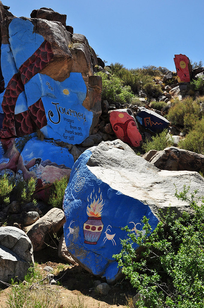 Roy Purcell's vibrant murals transform desert boulders into a psychedelic journey &ndash; an unexpected splash of color hidden in the monochrome landscape of the Cerbat foothills.