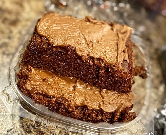 Chocolate cake that makes you question your loyalty to the red velvet. The frosting-to-cake ratio here is mathematical perfection.