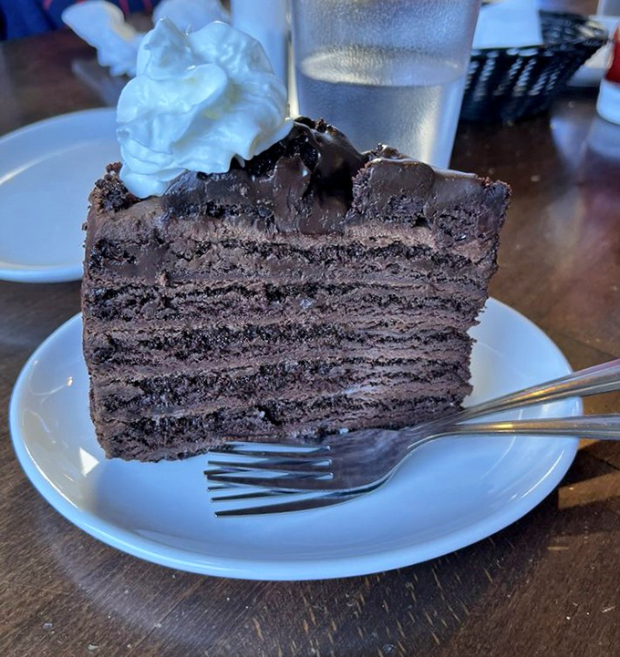 A slice of chocolate cake so rich it should come with its own tax bracket. The perfect sweet finale after a seafood marathon&mdash;because balance is important in life.