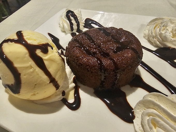 A chocolate lava cake that erupts with warm, gooey goodness. Surrounded by four dollops of whipped cream because one would never be enough.