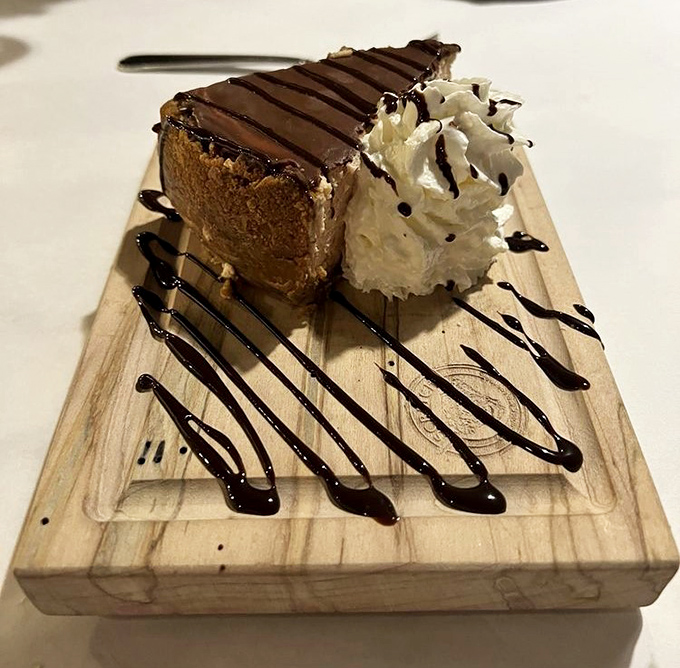 Dessert architecture at its finest&mdash;chocolate mousse cake presented like edible art. That whipped cream and chocolate drizzle are the accessories this runway model deserves.