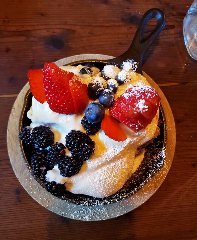Not just dessert, but a skillet of warm berries and cream that makes you question why you'd ever waste calories on lesser sweets.