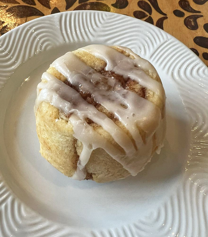 This cinnamon roll isn't just baked; it's crafted with the kind of care usually reserved for Renaissance sculptures or luxury automobiles.