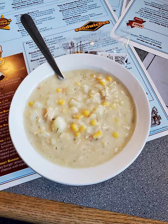 A bowl of clam chowder that whispers "New England" but speaks with a distinct Delaware accent&mdash;creamy, comforting, and studded with sweet corn.