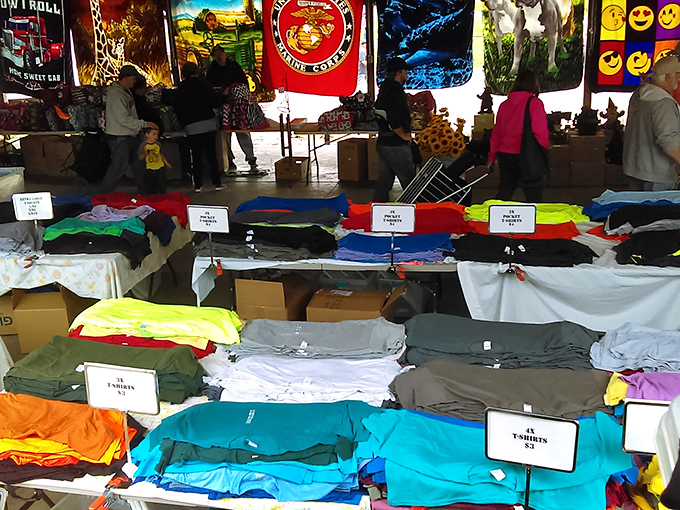 T-shirt paradise where fashion meets function. The perfect souvenir might be hiding in these neatly folded stacks of casual comfort.