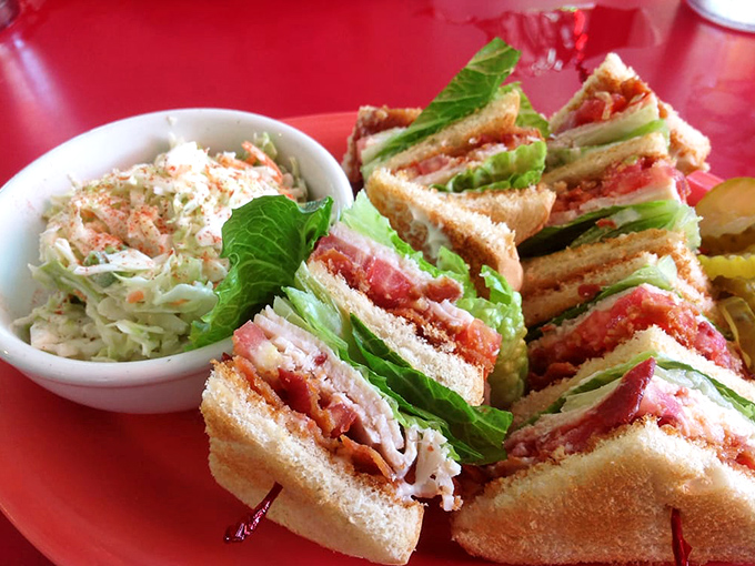 This club sandwich isn't playing around—it's stacked higher than a tourist's expectations and delivers more satisfaction than finding a parking spot in Key West.