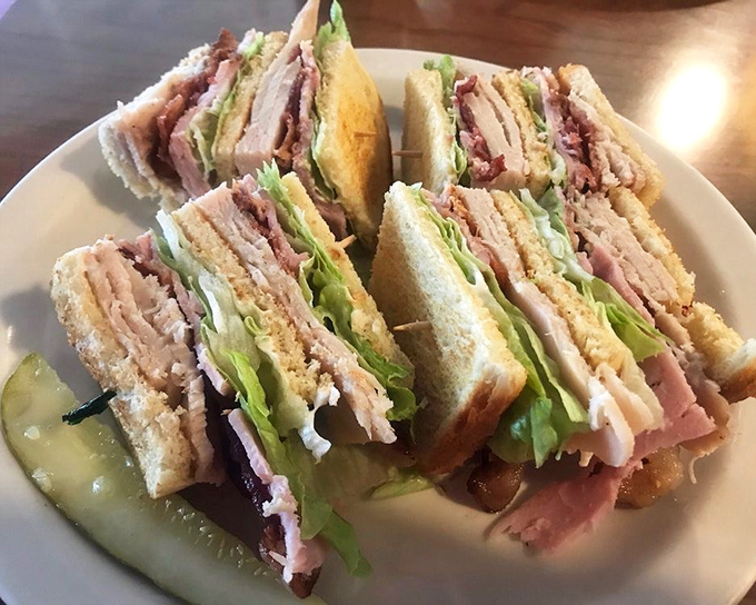 This club sandwich stands taller than Seattle's Space Needle and packs more layers than a Pacific Northwest winter wardrobe. The pickle adds just the right tang.