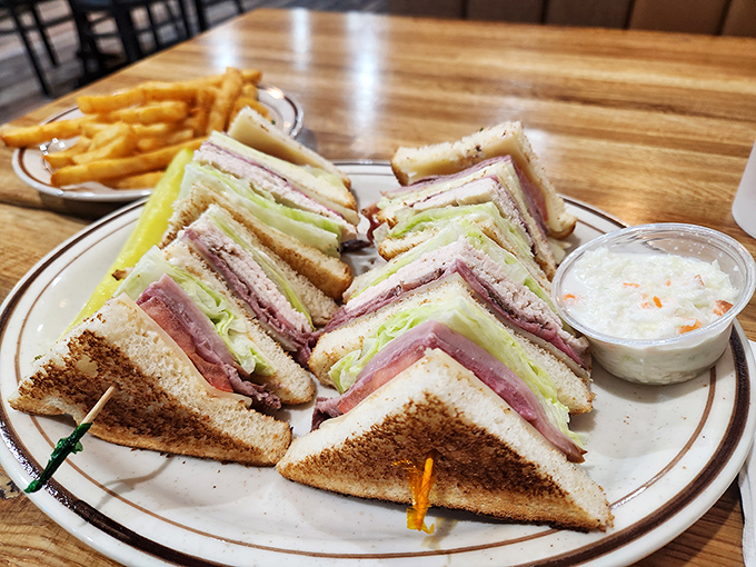 This club sandwich stands taller than most politicians' promises and delivers on every layer of its impressive architectural achievement.