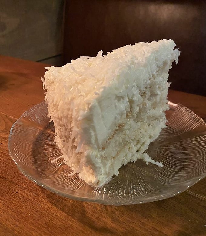Coconut cake that looks like it's wearing a winter coat of freshly fallen snow. Each forkful is a tropical vacation for your taste buds.
