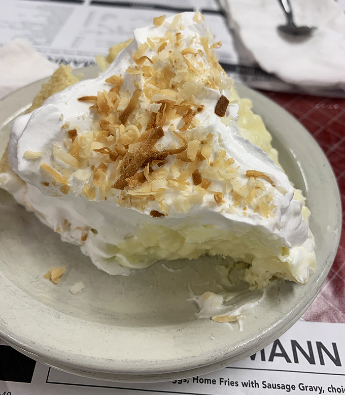Coconut cream pie with a meringue so high it needs FAA clearance. This isn't dessert&mdash;it's a fluffy cloud of happiness on a plate.
