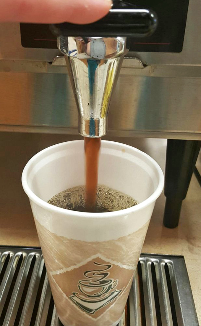 Coffee being dispensed like liquid gold&mdash;the perfect companion to whatever baked treasure you've selected from the display case.