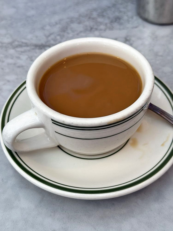 Coffee served in these sturdy mugs doesn't ask if you want single-origin or pour-over—it just does its job, reliably.