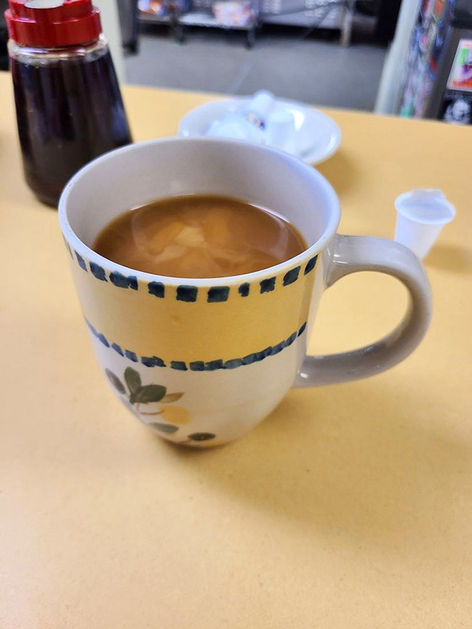 Coffee served in a mug with character. In the diner universe, the more personality your coffee cup has, the better the coffee tastes.