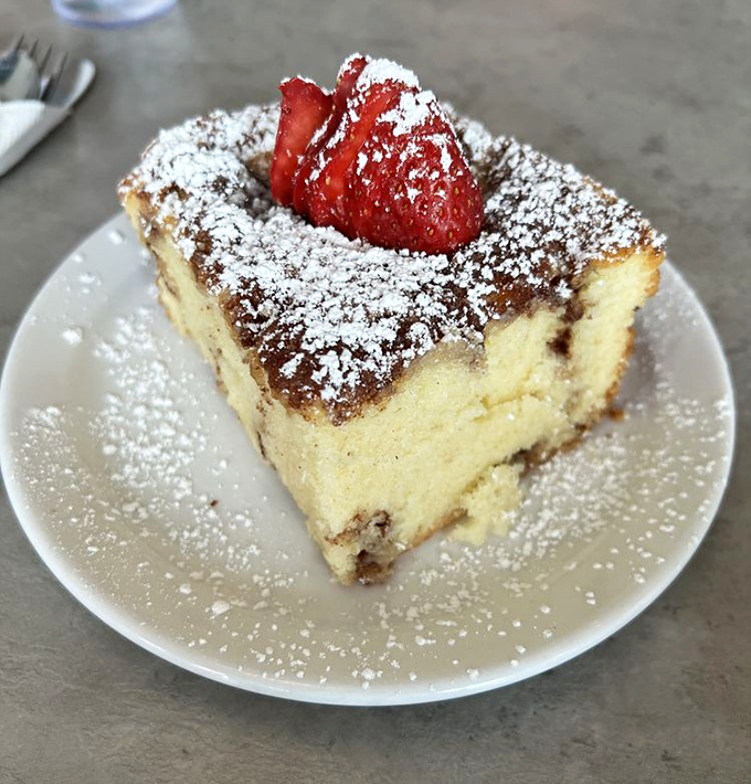 Glo's famous coffee cake – a cinnamon-swirled masterpiece topped with powdered sugar and a strawberry – is basically dessert masquerading as breakfast, and we're here for it.
