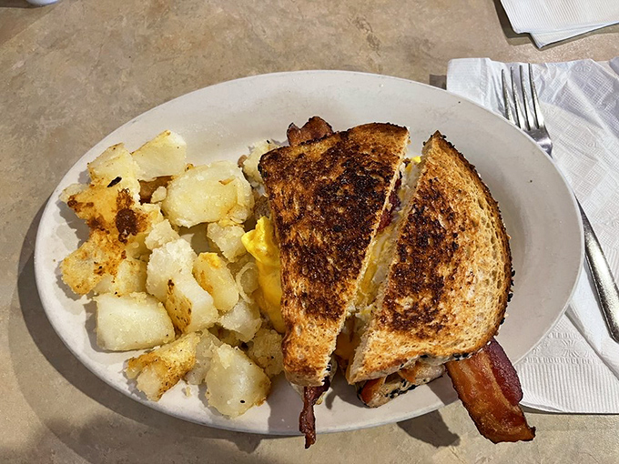 This grilled cheese isn't playing games&mdash;it's bringing reinforcements of perfectly golden bread and home fries that refuse to be upstaged.